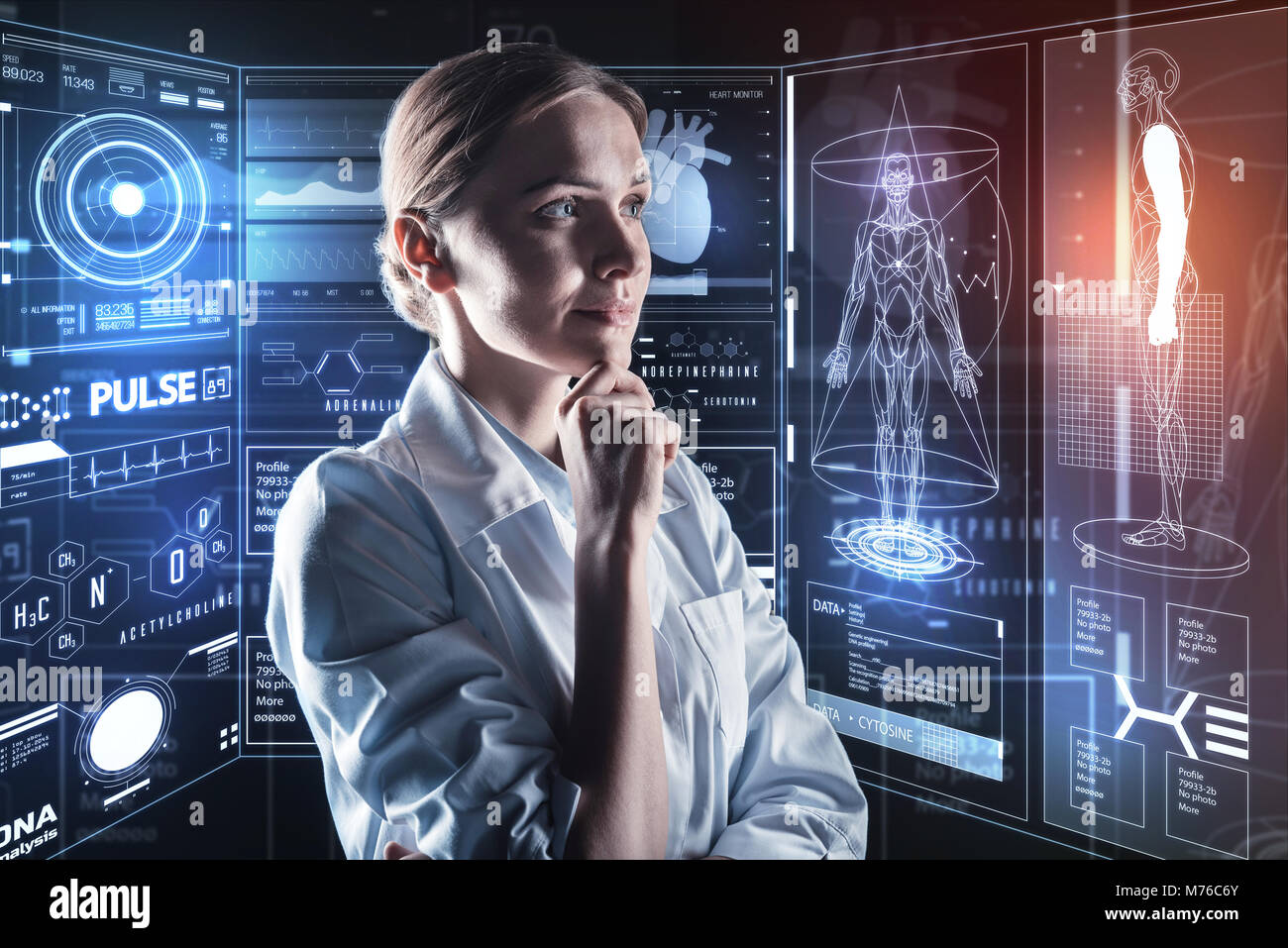 Beautiful doctor thoughtfully touching her chin and looking interested ...