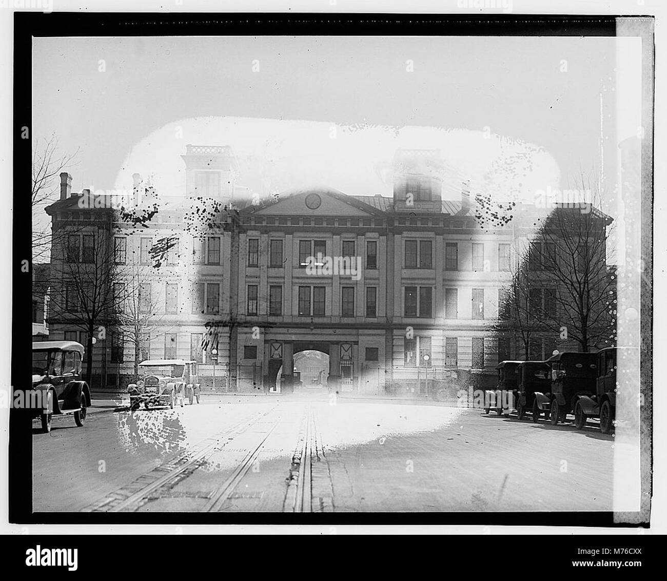A historical photograph of the gate at a navy yard, depicting the ...