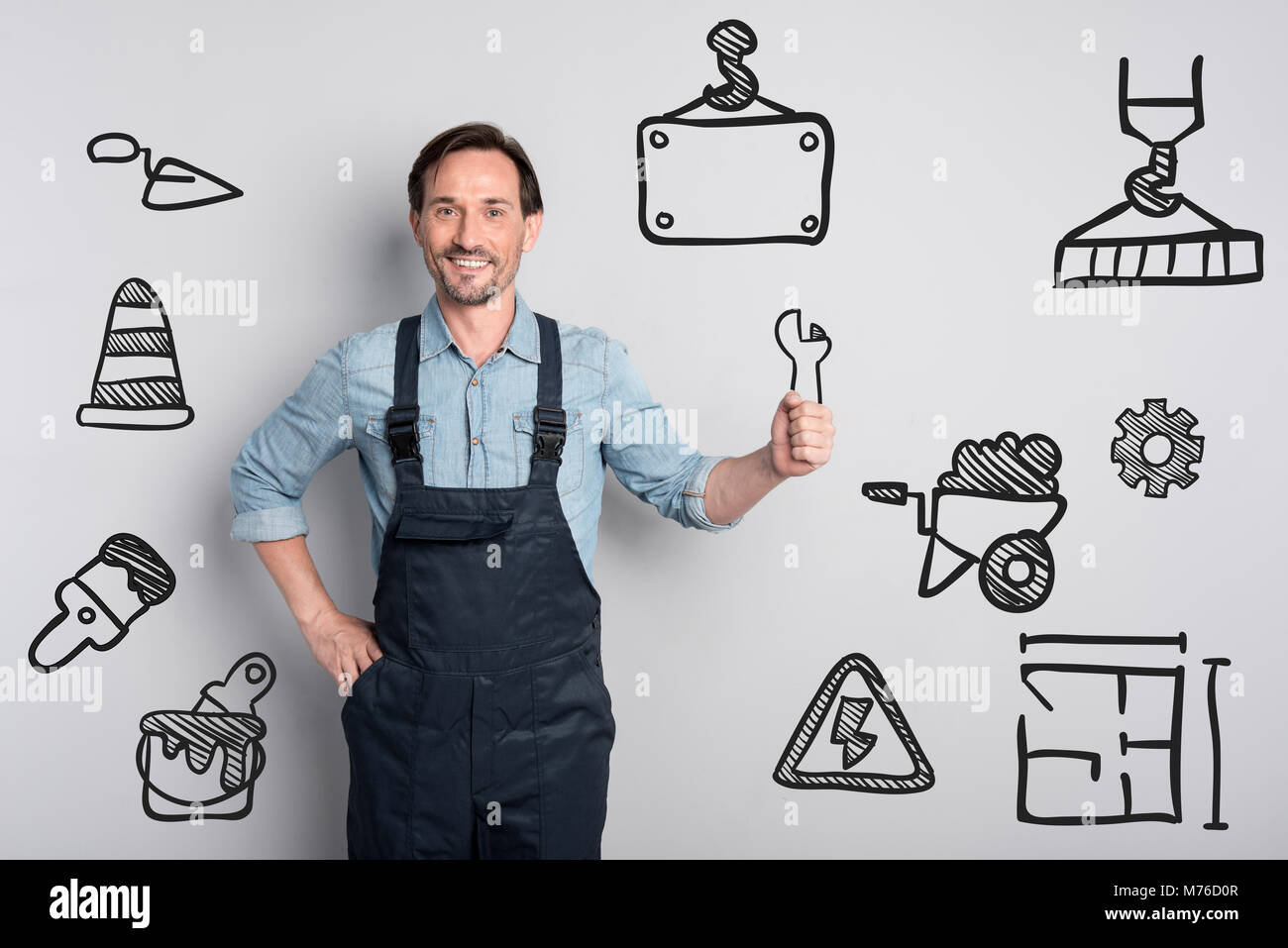 Emotional builder smiling while getting ready for work Stock Photo - Alamy