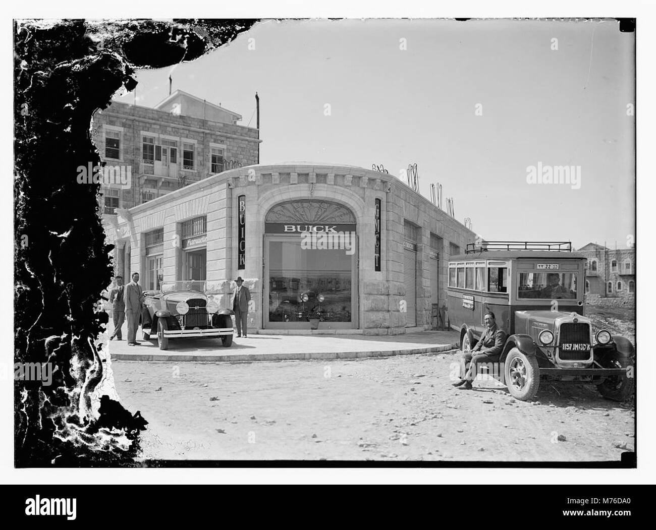 A new Buick and GMC bus is displayed outside a Buick agency ...