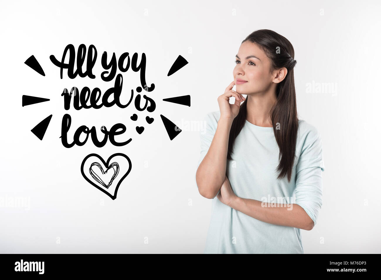 Cute woman touching her face and dreaming about finding love Stock ...