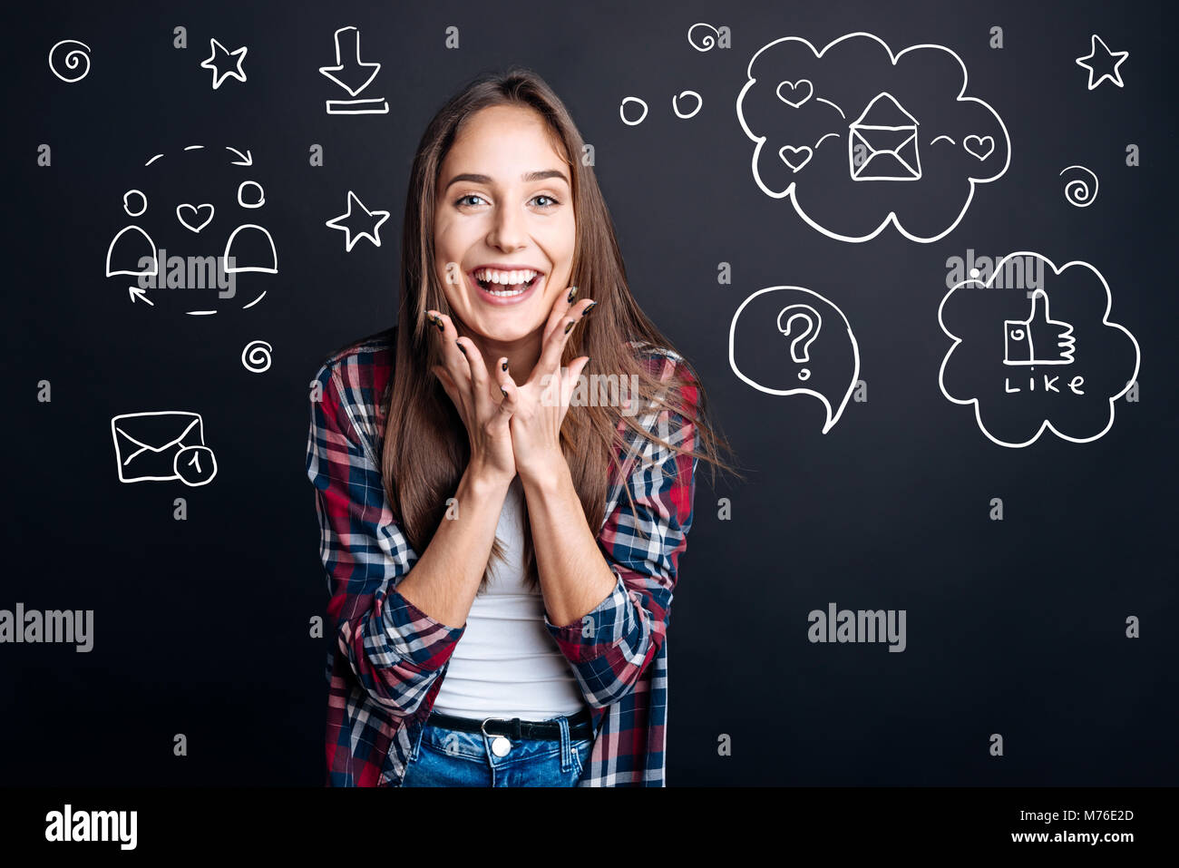 Happy person smiling while checking her profile in social network Stock ...