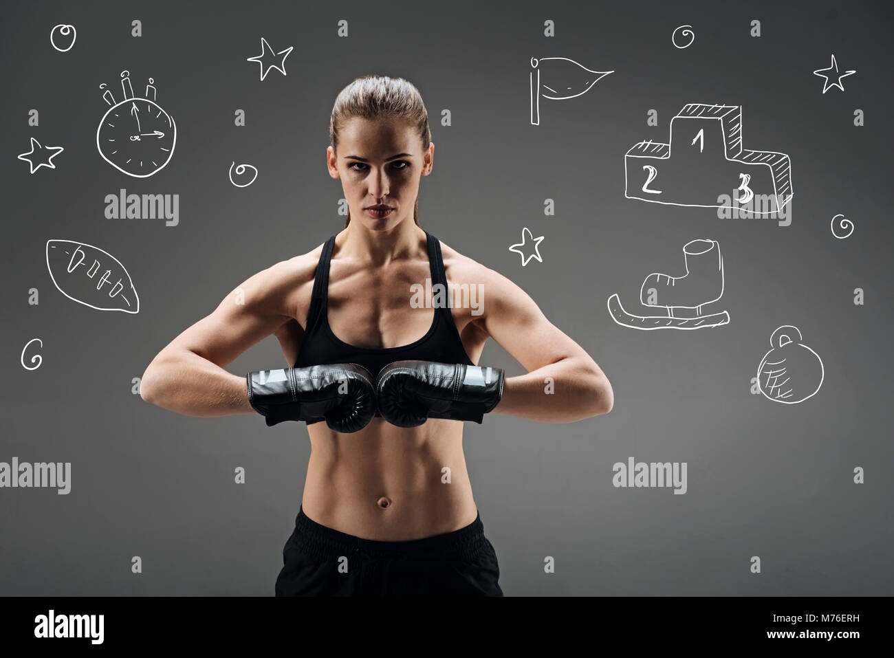 Serious young boxer feeling confident before going to a boxing ring ...