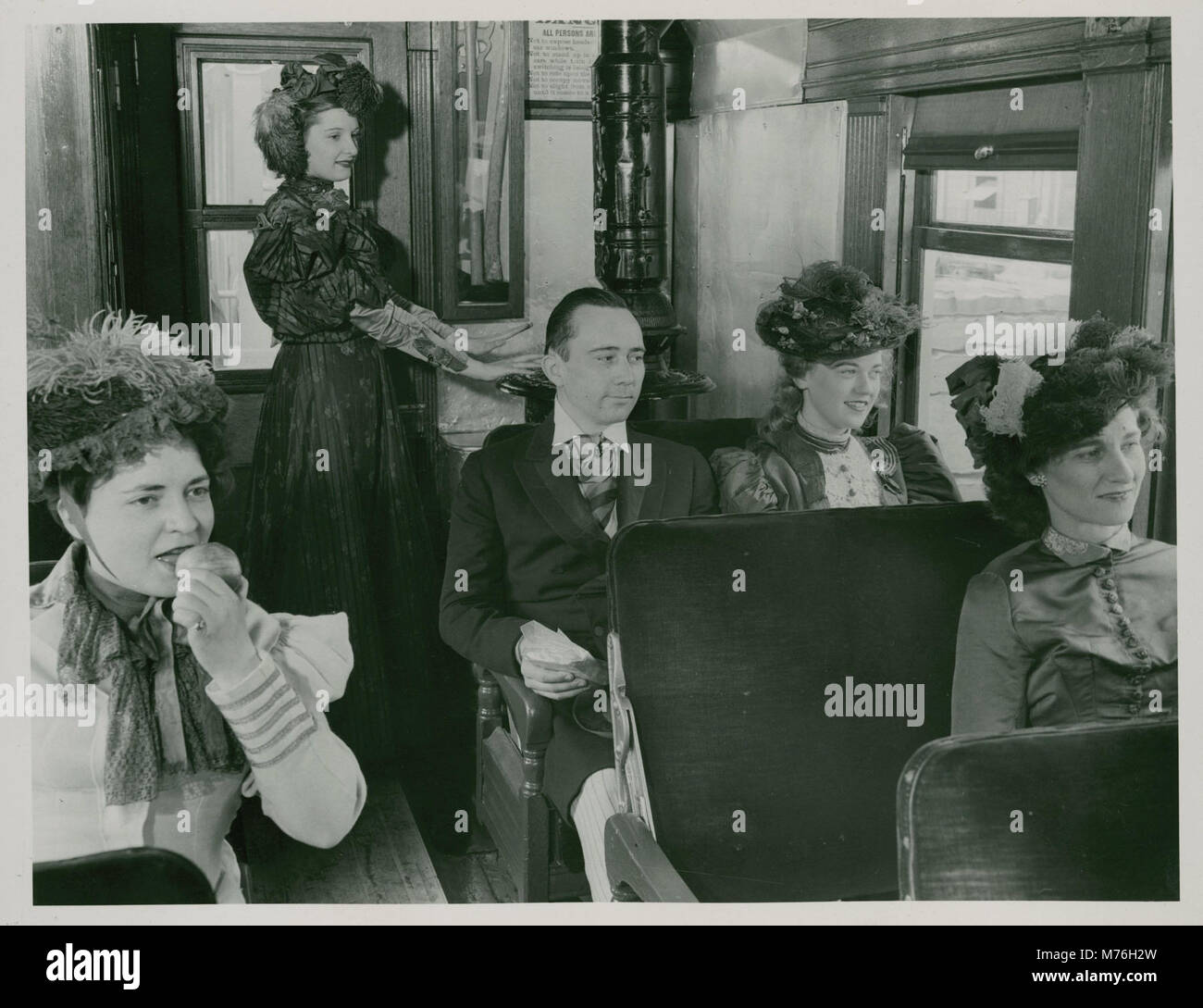 A photograph of passengers aboard a train at the Chicago Railroad Fair ...