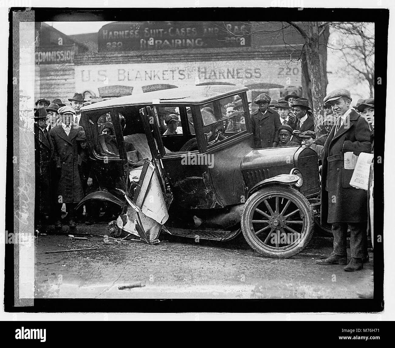 This image depicts the aftermath of an automobile wreck, capturing the ...