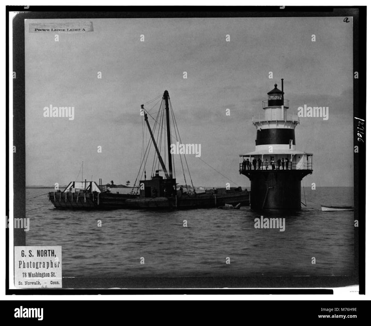 Peck's Ledge Light, a lighthouse located off the coast, photographed by ...