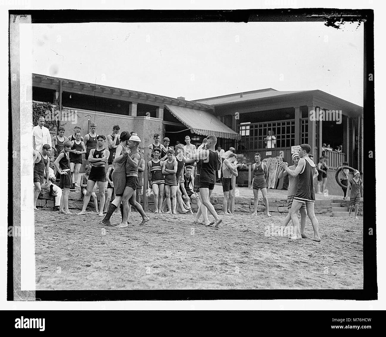 A photograph of people dancing on a beach on June 7, 1922, capturing a ...