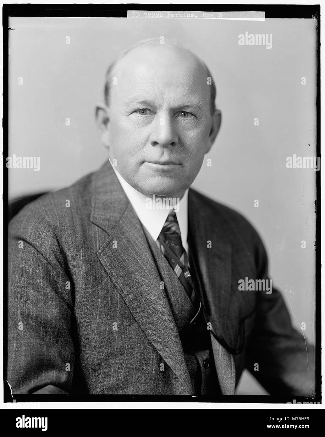 A formal portrait of Honorable R. Perkins, capturing his esteemed ...