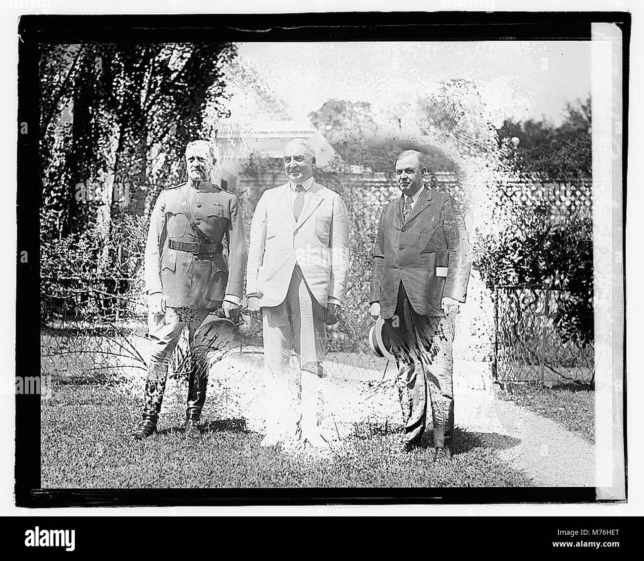 This photograph features three prominent figures from American history ...
