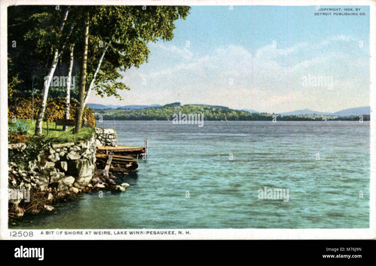 A serene view of a lakeshore at Lake Winnipesaukee, captured in the ...