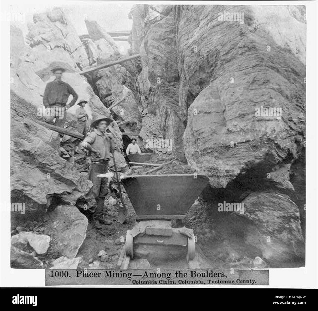 This image depicts placer mining at the Columbia Claim in Tuolumne County, California. Miners ...