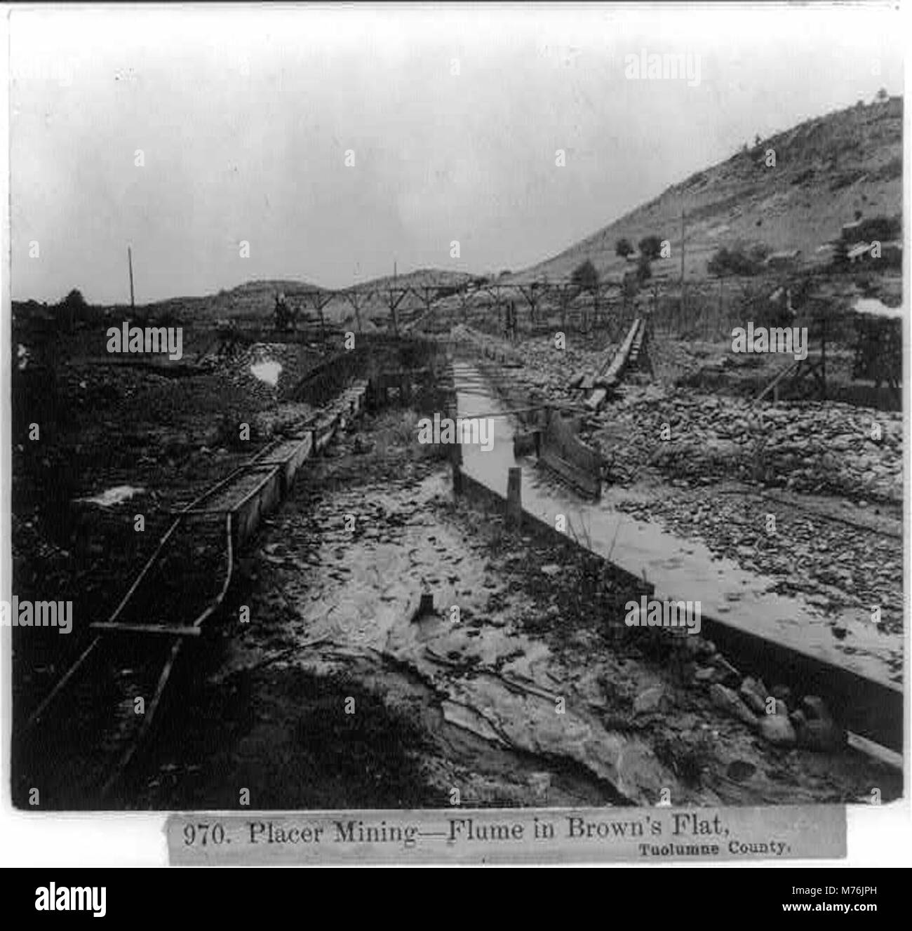 The image captures placer mining using a flume in Brown's Flat ...