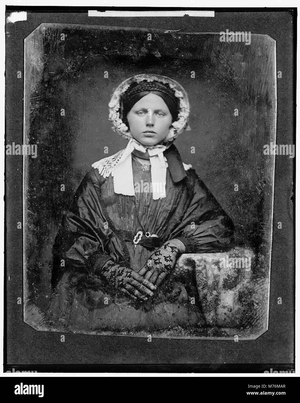 A portrait of Miss E.B. Purman, capturing her formal appearance. The ...