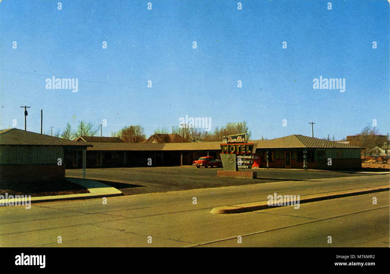 The photograph depicts the Rambler Motel, a 20th-century American ...