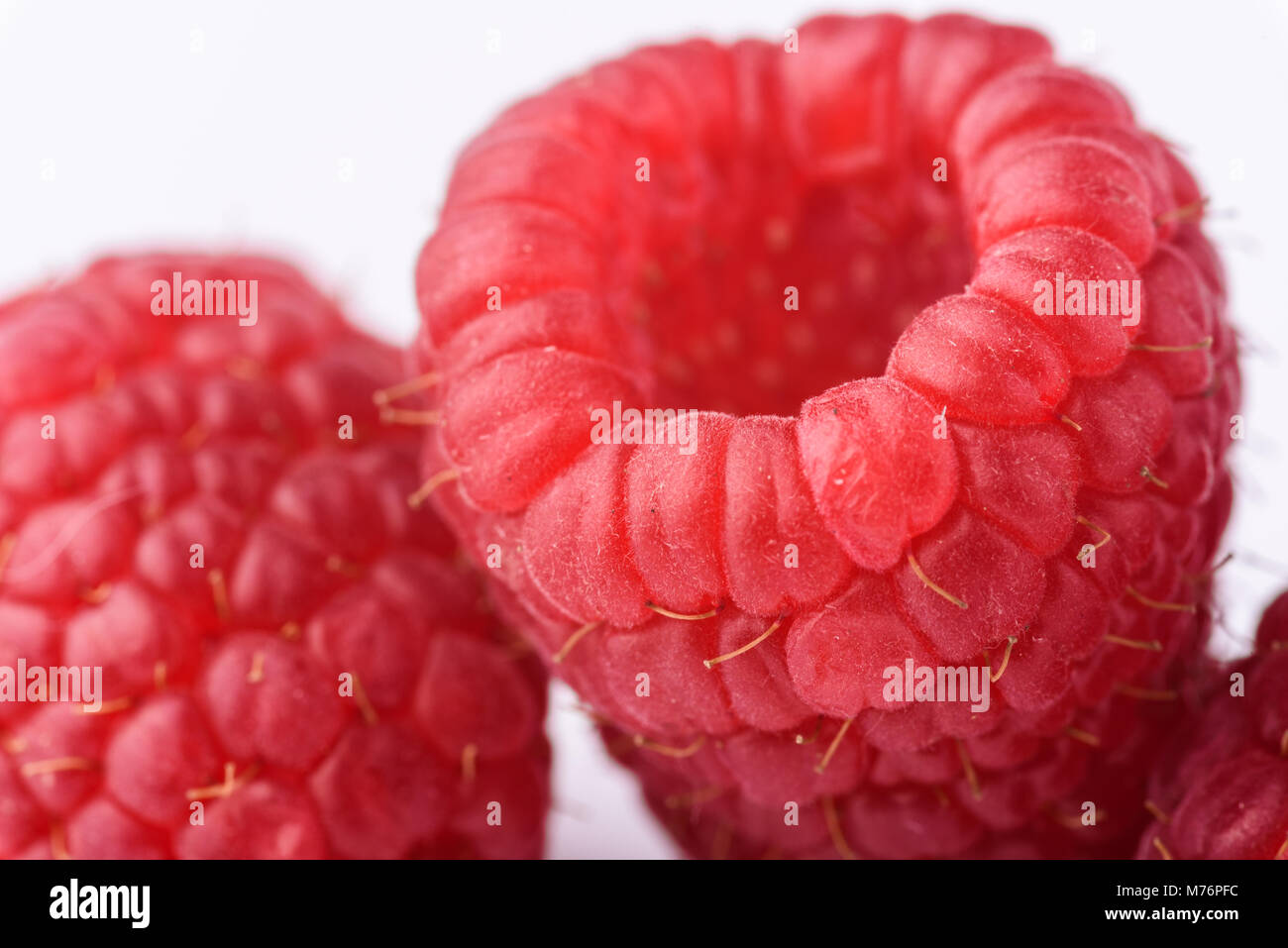 Raspberry closeup detail isolated white background Stock Photo - Alamy