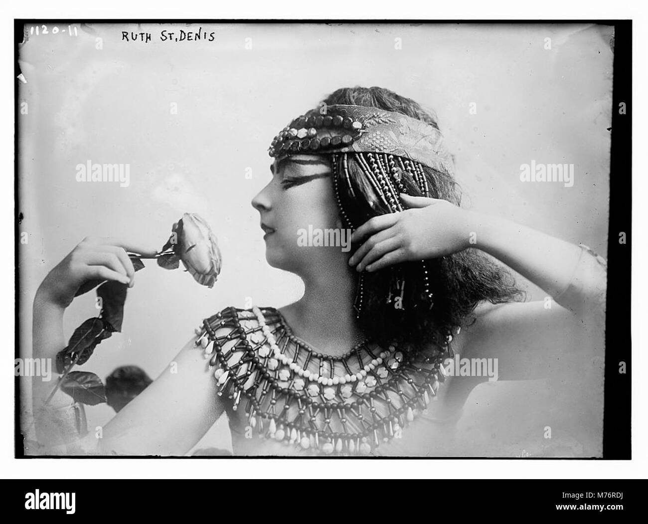 Ruth St. Denis, a celebrated actress and dancer, captured holding a ...