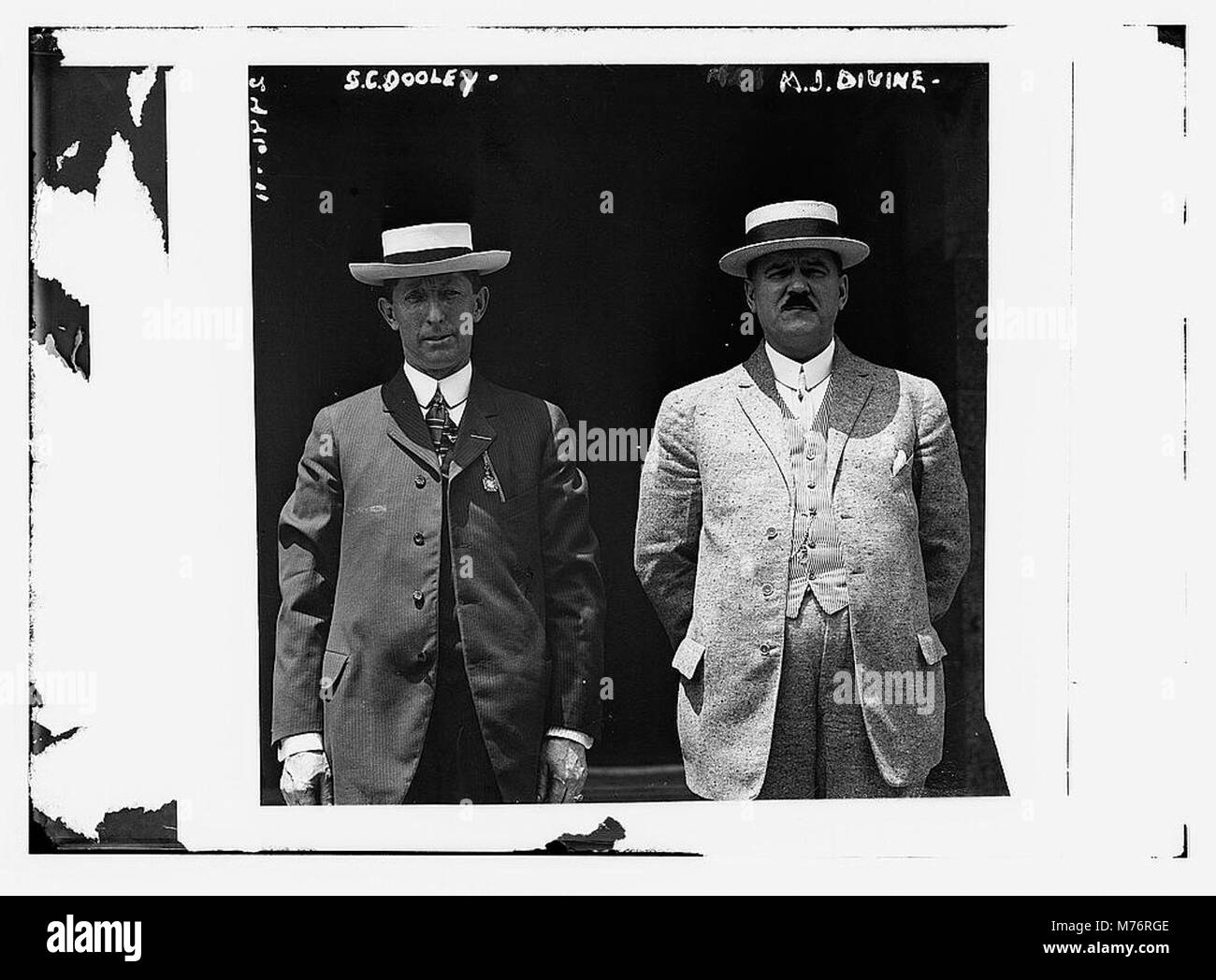 A photograph featuring individuals S.C. Dooley and M.J. Divine ...