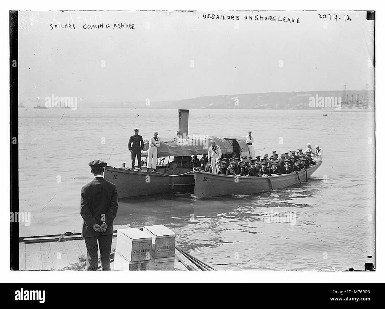 A historical photograph of sailors disembarking for shore leave ...