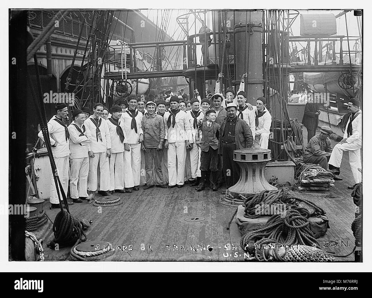 This image depicts U.S. Navy sailors aboard a training ship docked in ...