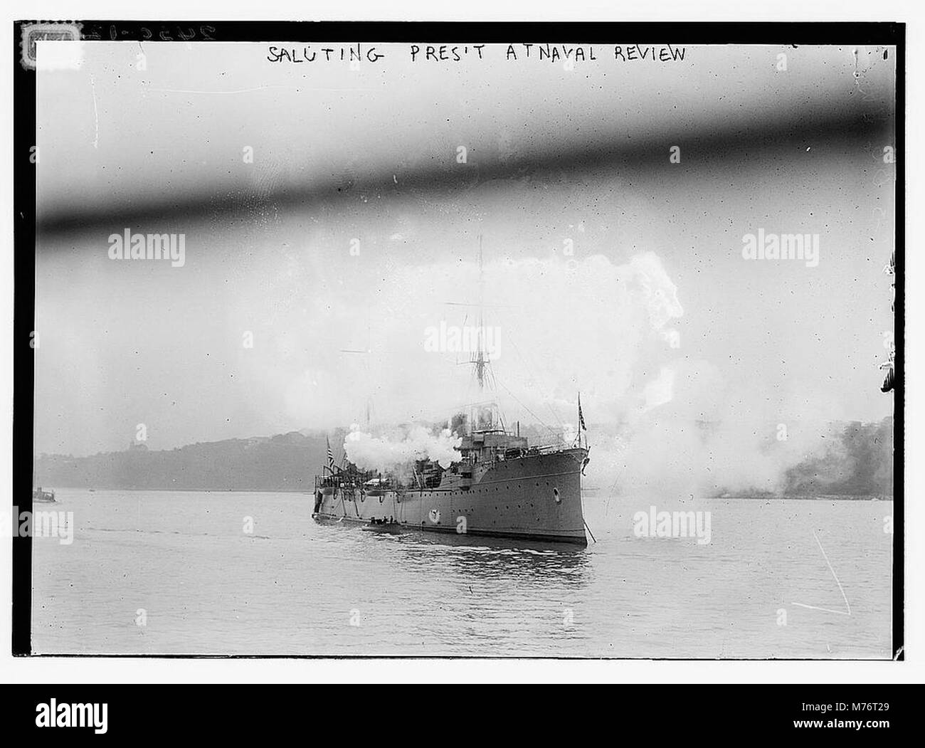 An image of military personnel saluting the president during a naval ...