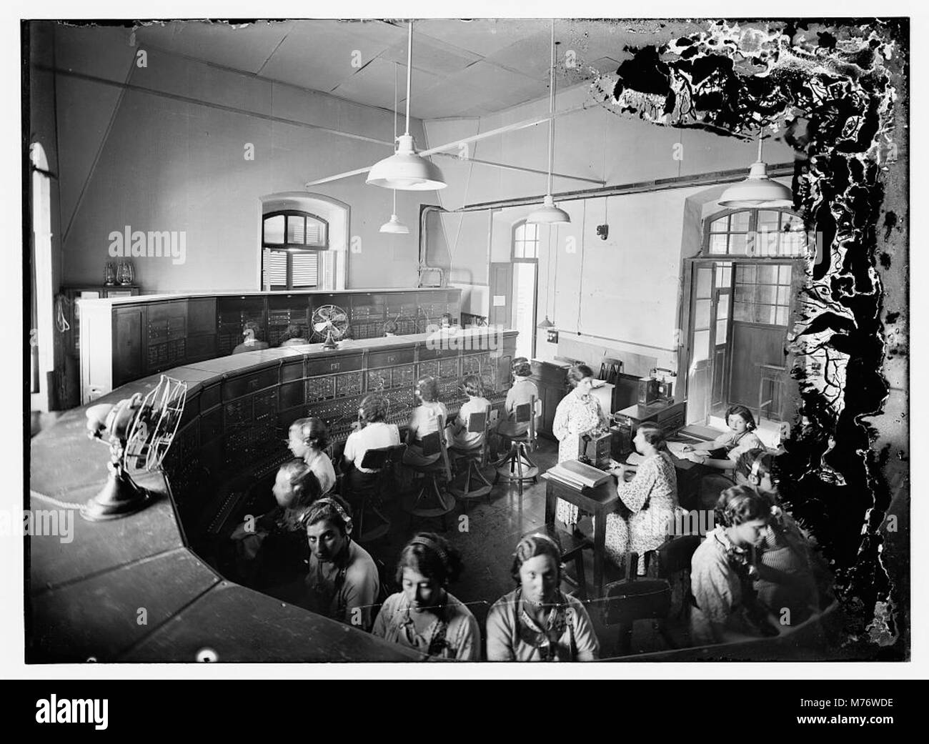 The image shows a semi-circular switchboard room, likely part of an ...