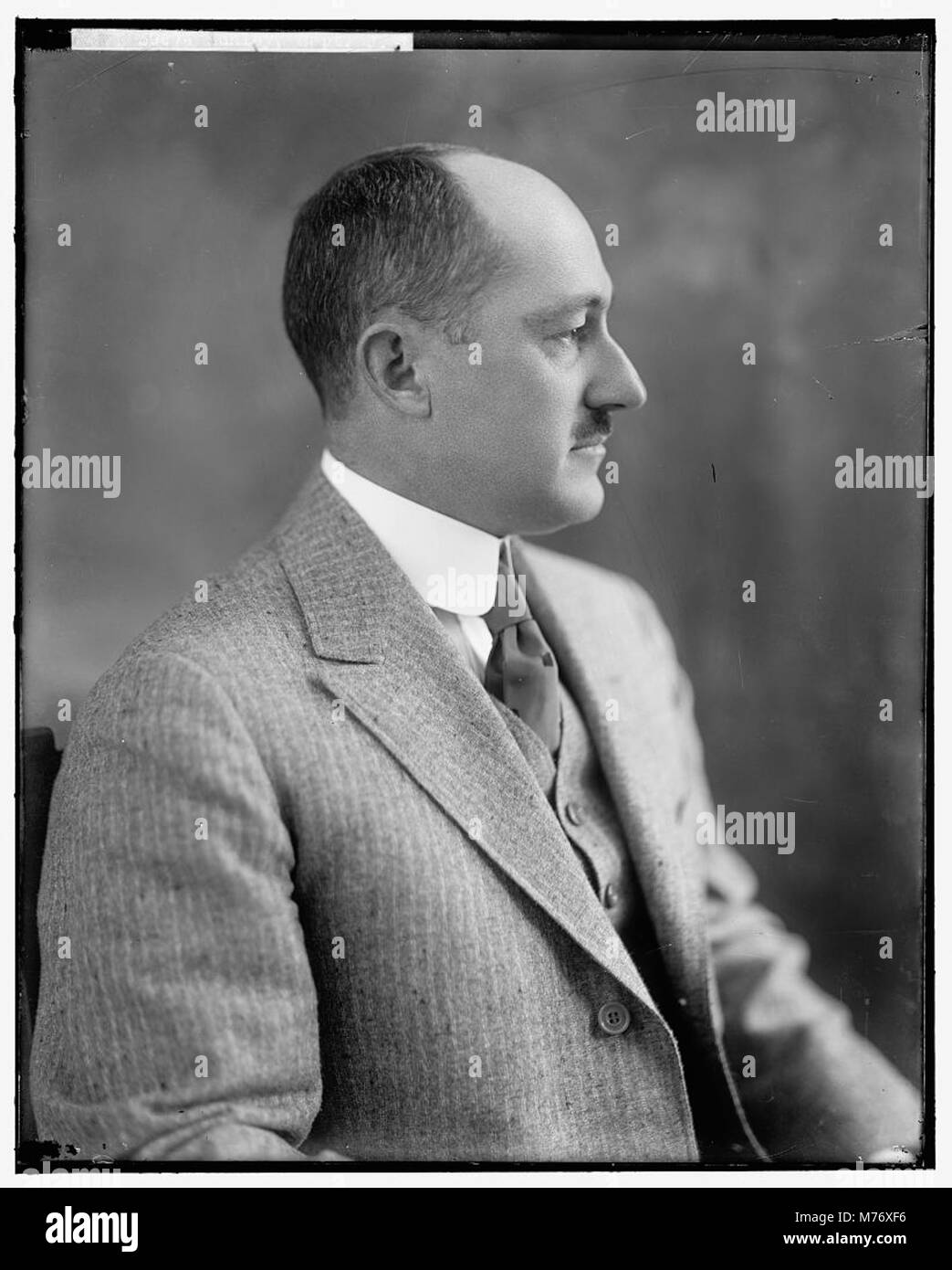 A formal portrait of Captain J.L. Shley, showcasing his role in the ...