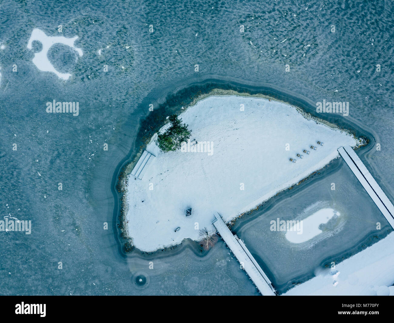 Aerial Photography of an Island Covered in Snow with a Frozen Lake ...