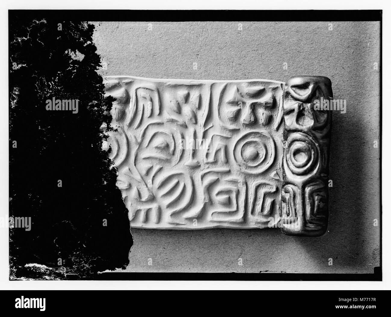 A collection of stone objects, including tools and sculptures, possibly ...