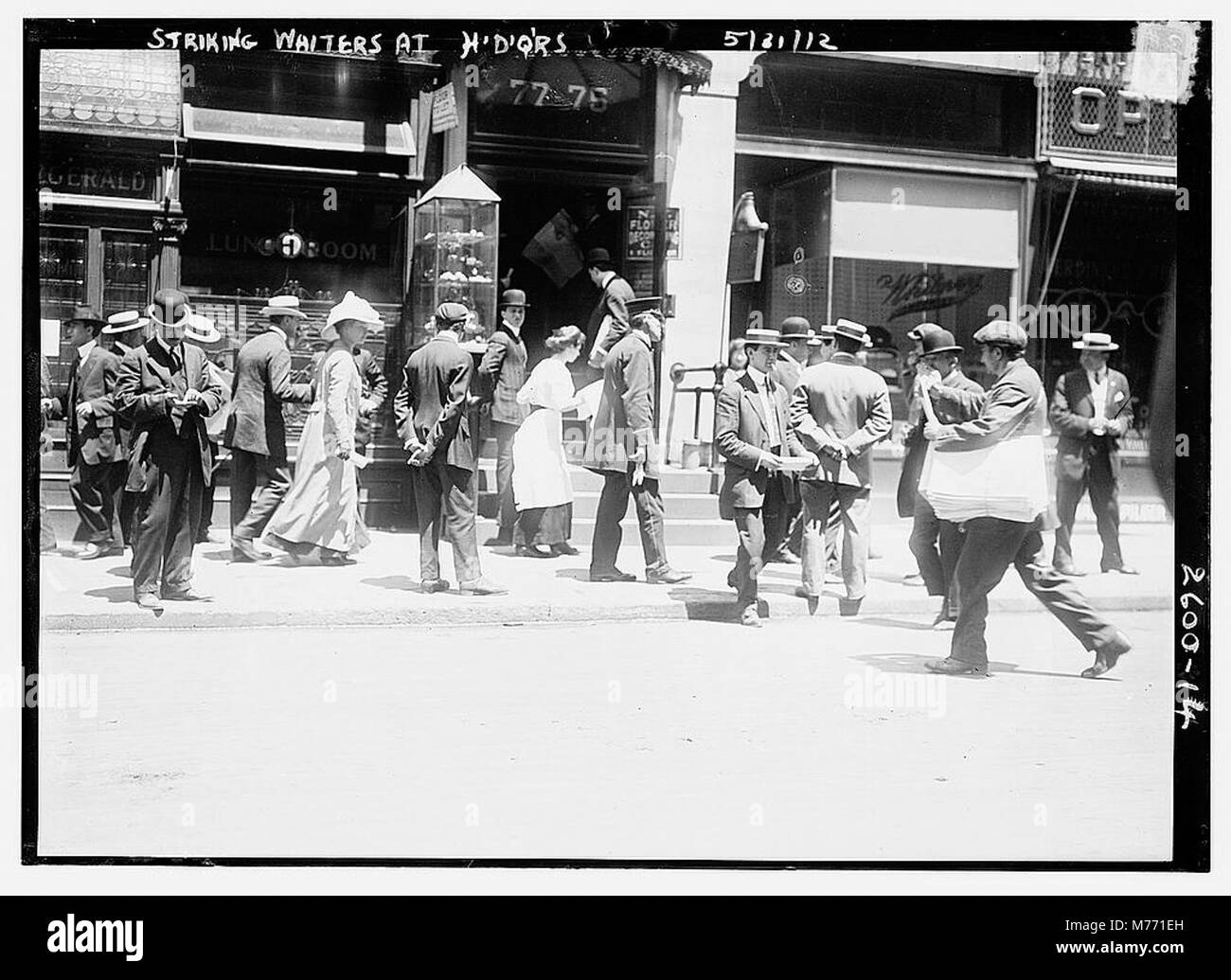 A historical photograph showing striking waiters at the headquarters ...