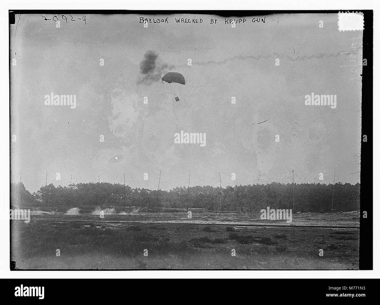 A historical image depicting a balloon destroyed by a Krupp gun during ...