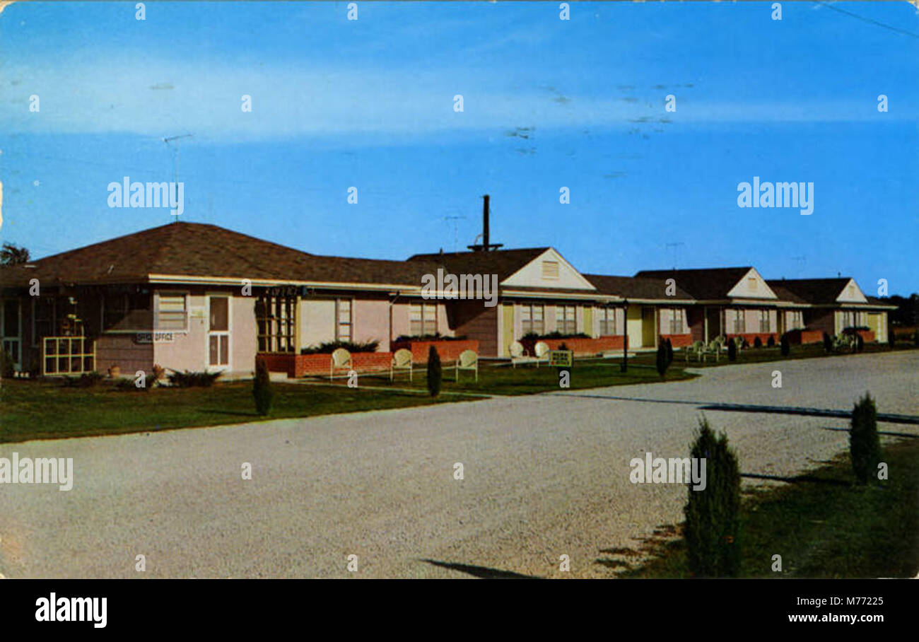 This photograph shows the Sunset Ranch Motel, a roadside motel likely ...
