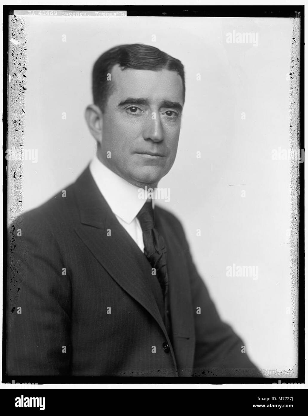 A formal portrait of Thomas B. Sweeney, a public figure, captured in a ...