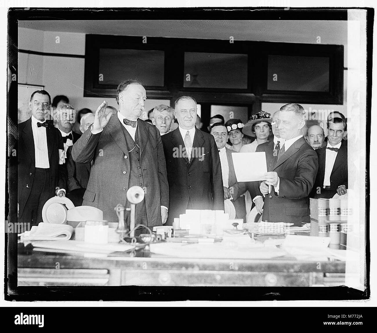 A historical image of President William Howard Taft being sworn into ...