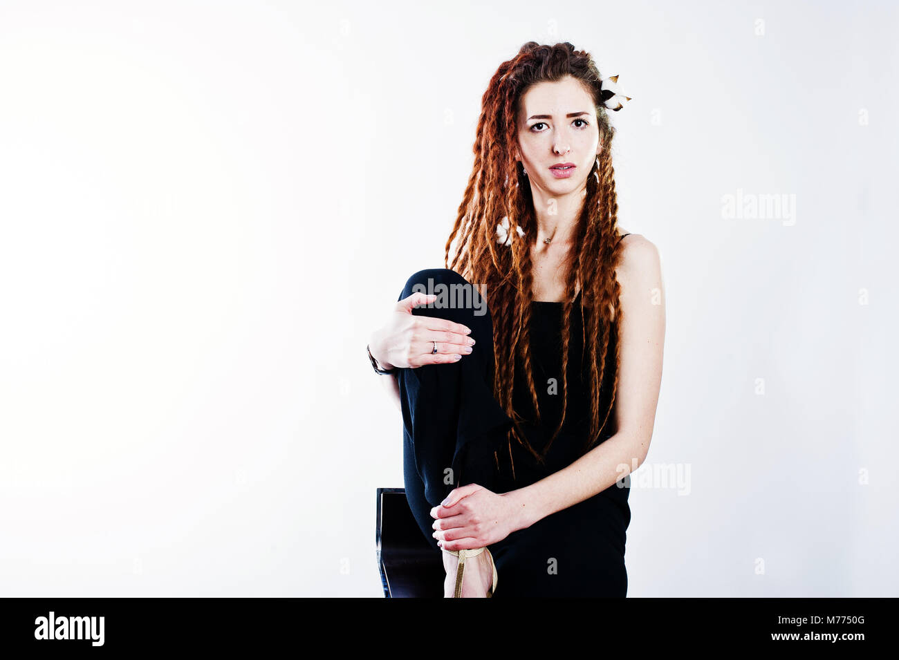 Studio shoot of girl in black with dreads on white background Stock Photo - Alamy