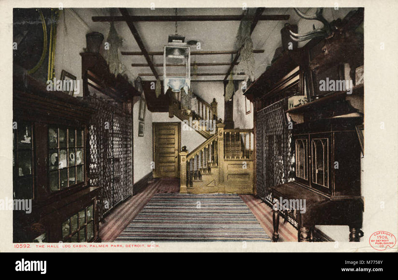 This image shows a log cabin hall at Palmer Park, a historical site ...