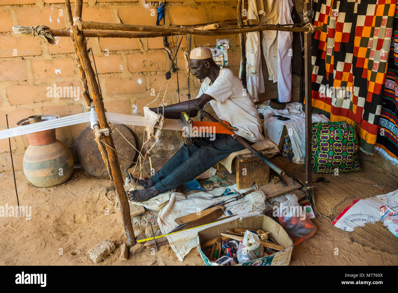 Man weaving on a traditional loom in the National Museum, Niamey, Niger ...