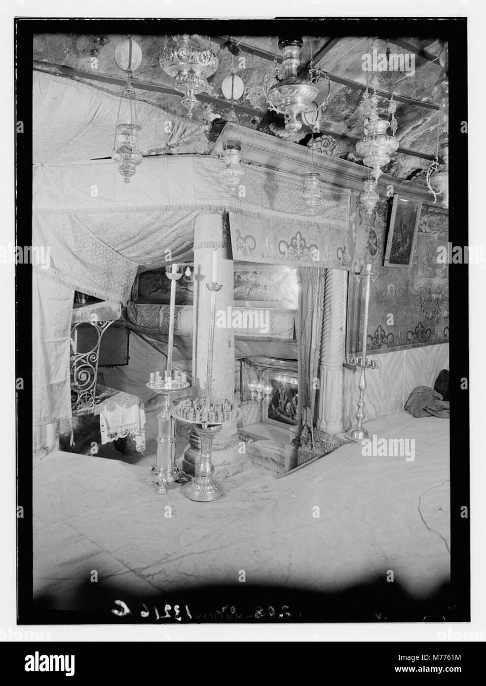 A photograph of the manger at the Church of the Nativity in Bethlehem ...