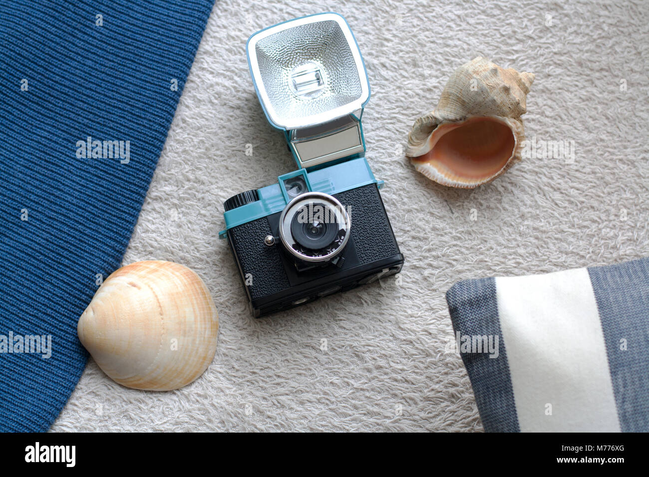Abstract beach composition with vintage film camera, seashells and ...