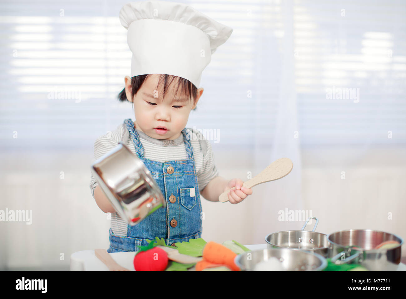 baby girl pretend play food toy Stock Photo - Alamy