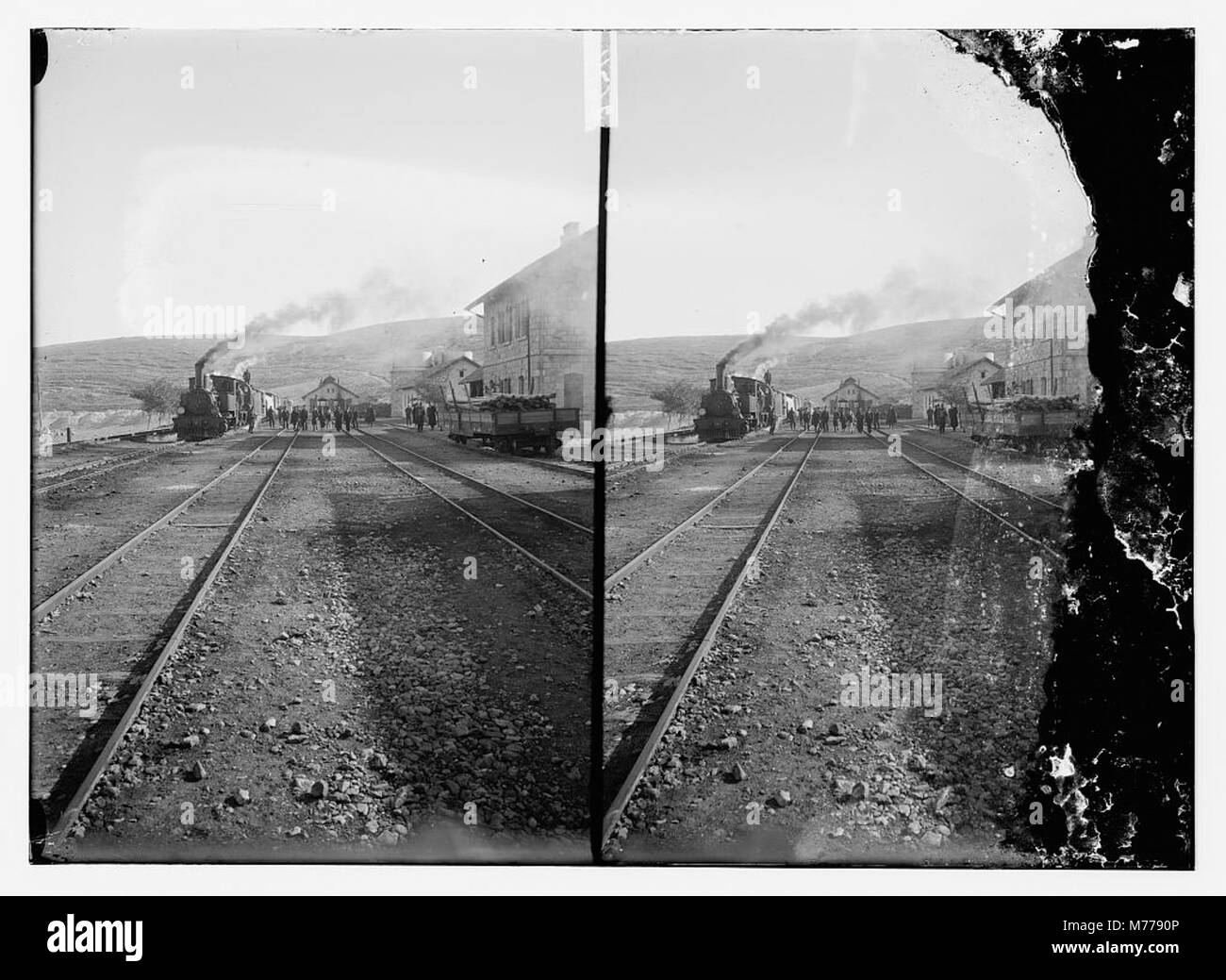 A historical photograph of a train station, showcasing the architecture ...