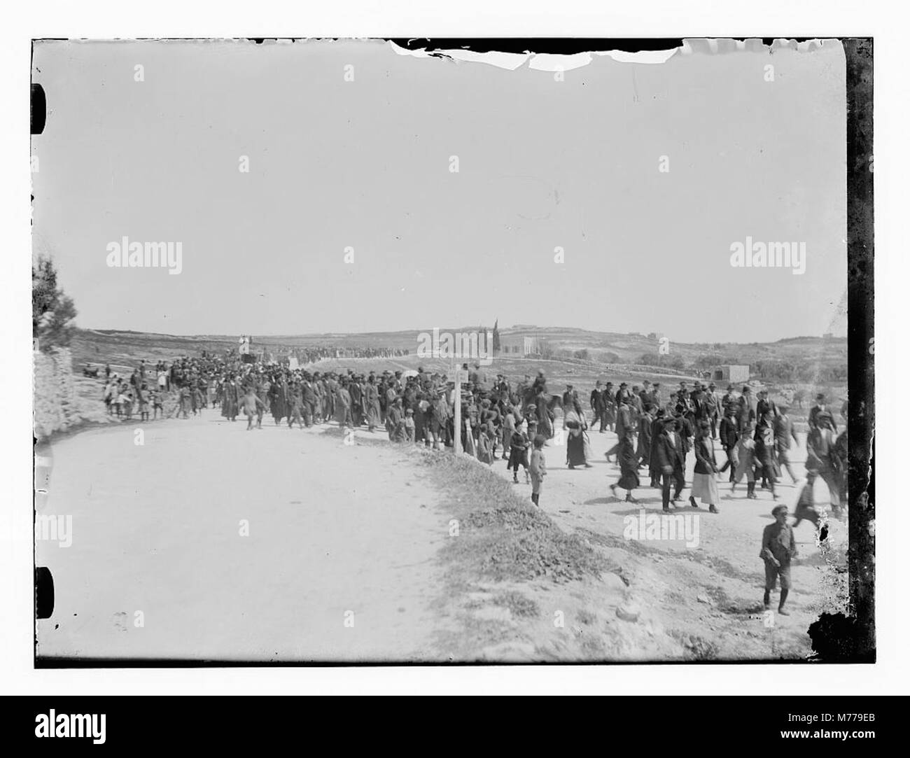 A historic photograph capturing a Turkish procession, displaying ...
