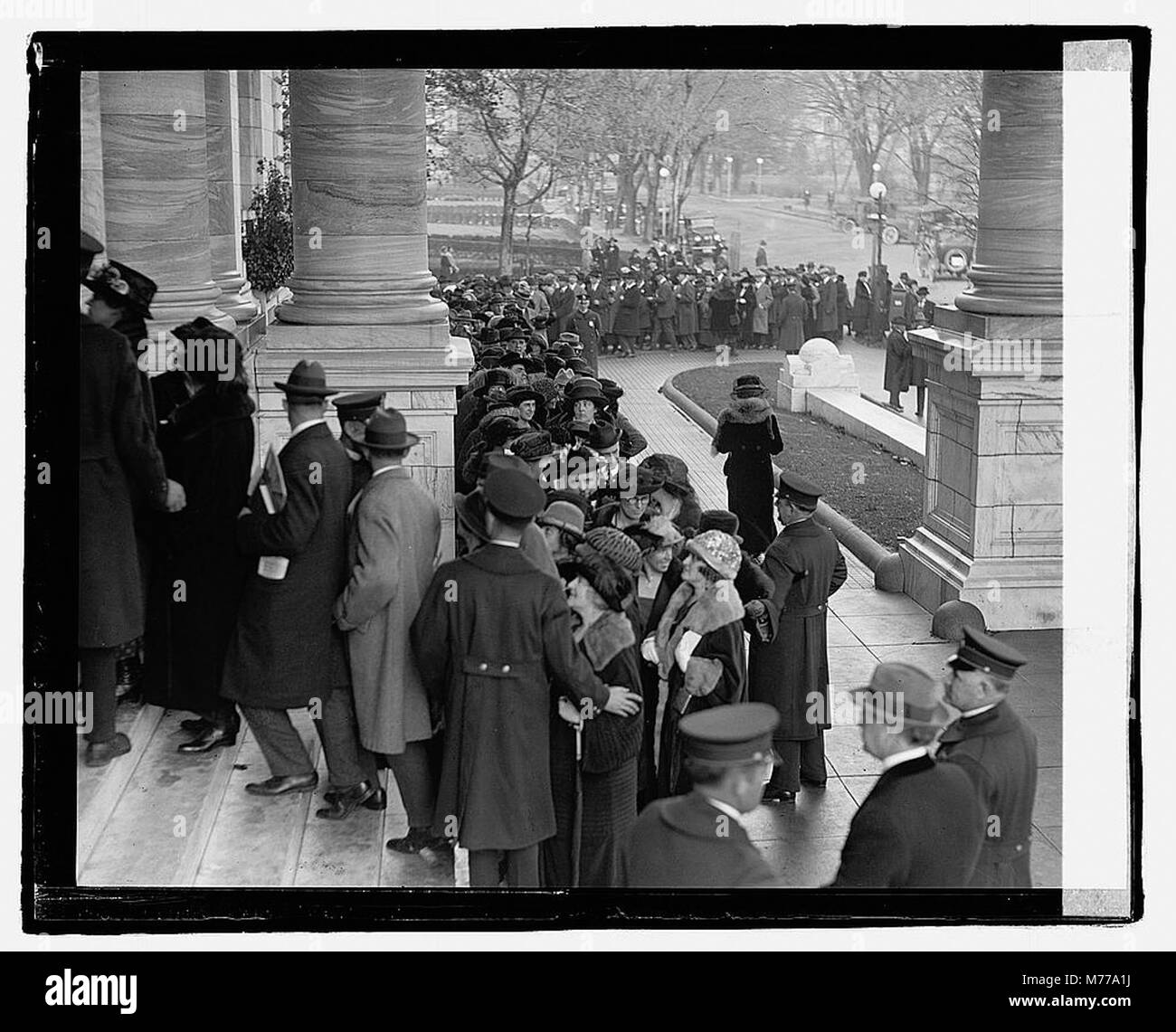 Unidentified people standing in line outside building), 12-8-22 LOC ...