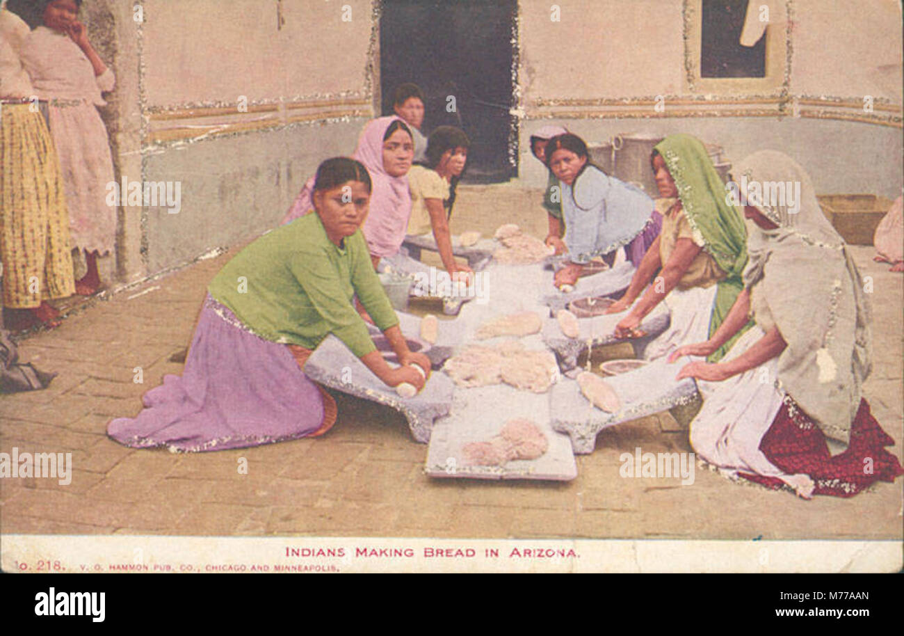 An image capturing Native American individuals making bread, identified ...