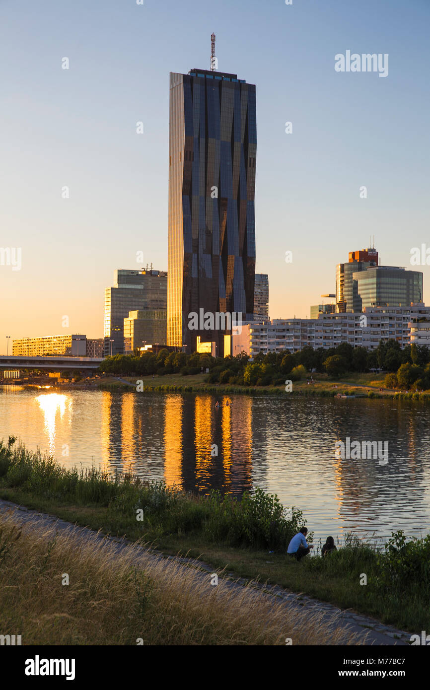 Donau City and DC building reflecting in New Danube River, Vienna ...