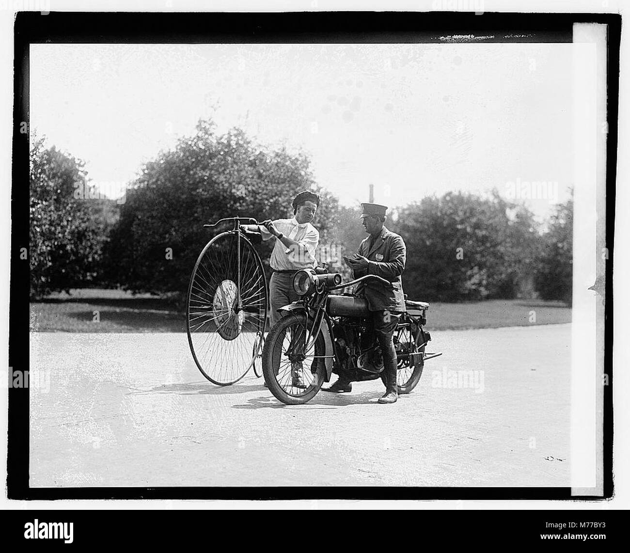 A photograph of a velocipede and motorcycle, capturing the early stages ...