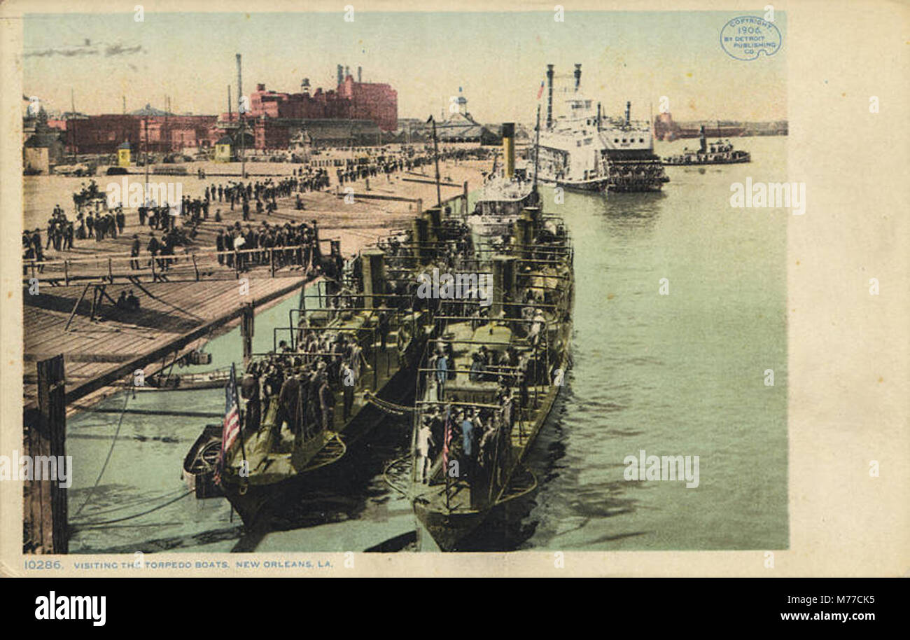 A historical photograph depicting a visit to torpedo boats, likely showcasing military naval ...