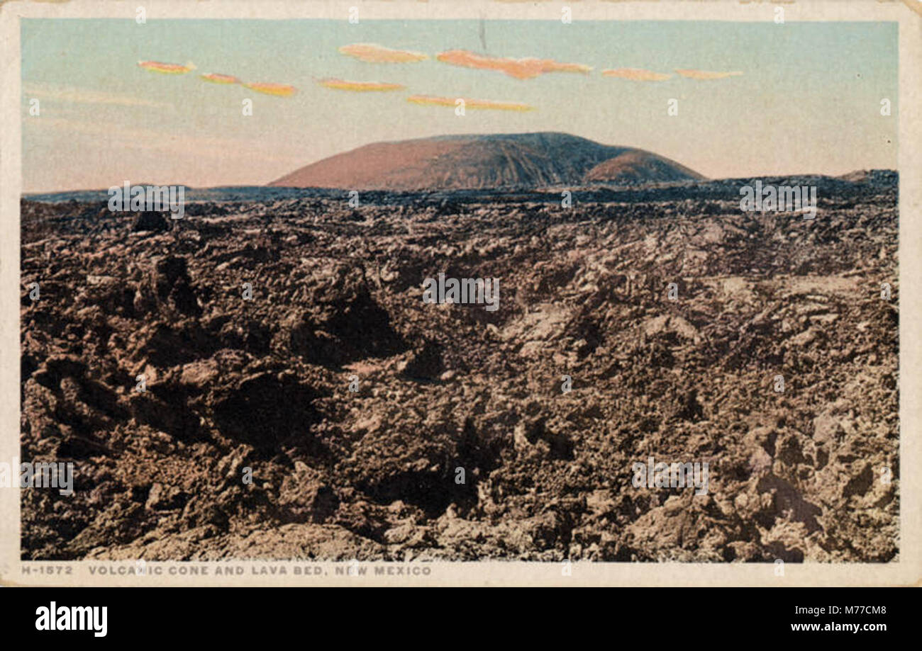 A dramatic landscape showing a volcanic cone and surrounding lava bed ...