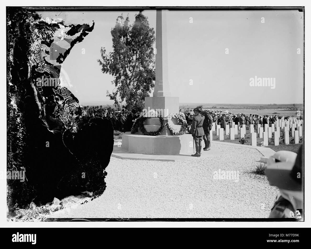 Photograph of a ceremony at a war cemetery, honoring fallen soldiers ...