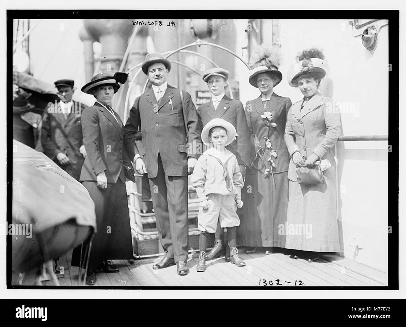 This photograph features William Loeb, Jr., a notable American figure ...