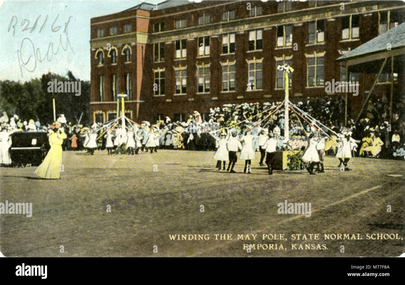 This photograph captures the tradition of winding the May Pole at a ...